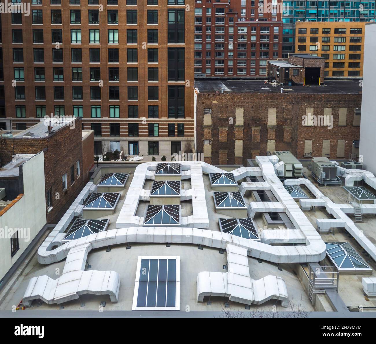 HVAC ducts and skylights on the roof of a building in Chelsea in New ...