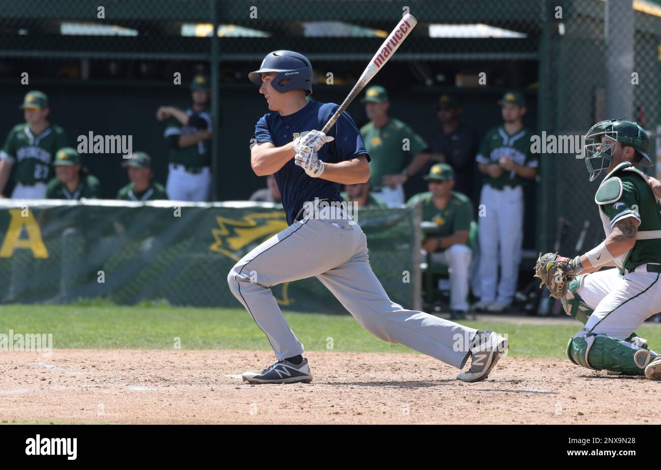 Cal State Monterey Bay Otters catcher Hayden Duer follows through on a ...