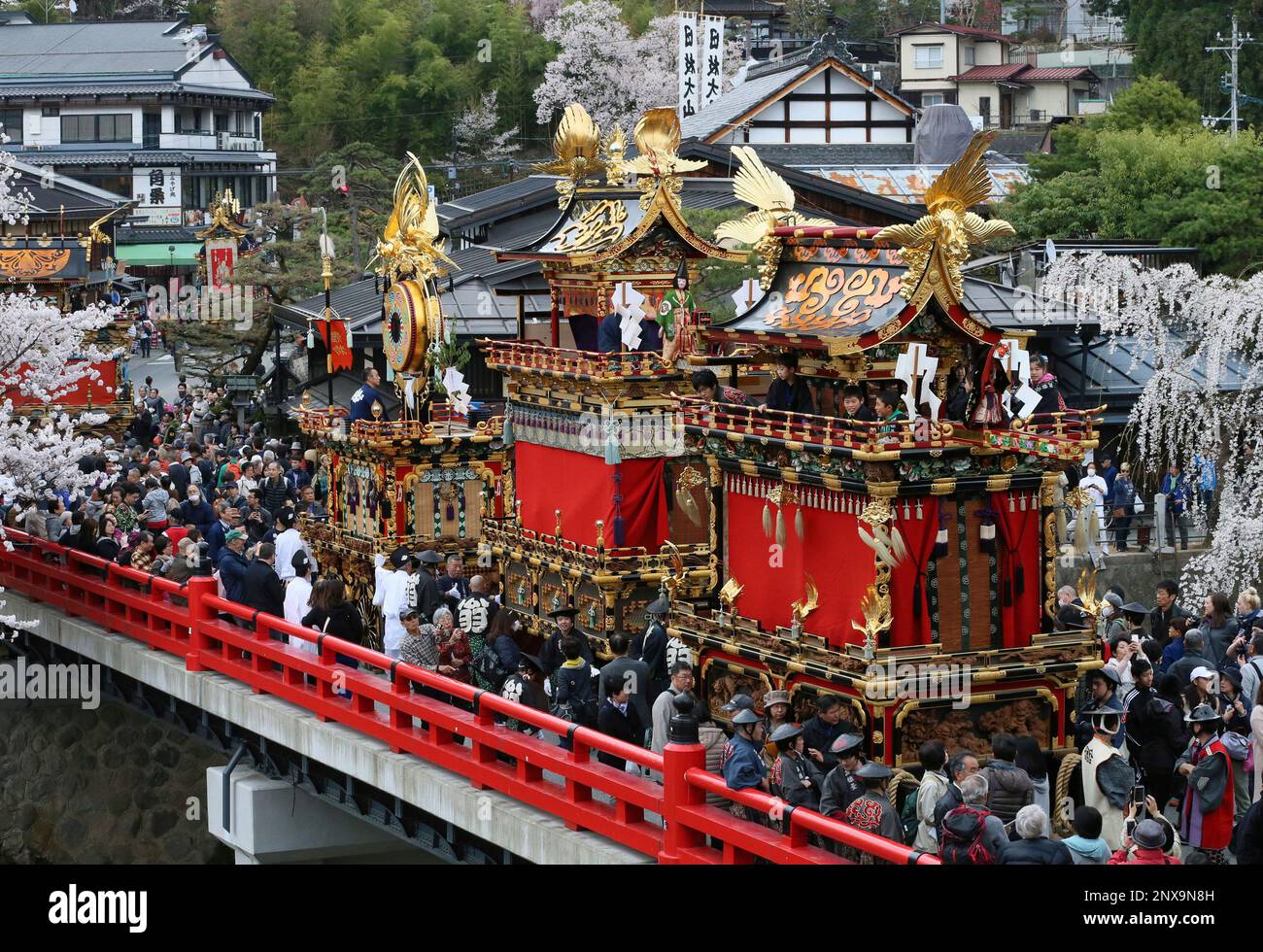 Floats decorated with lanterns parade during Takayama Spring Festival ...