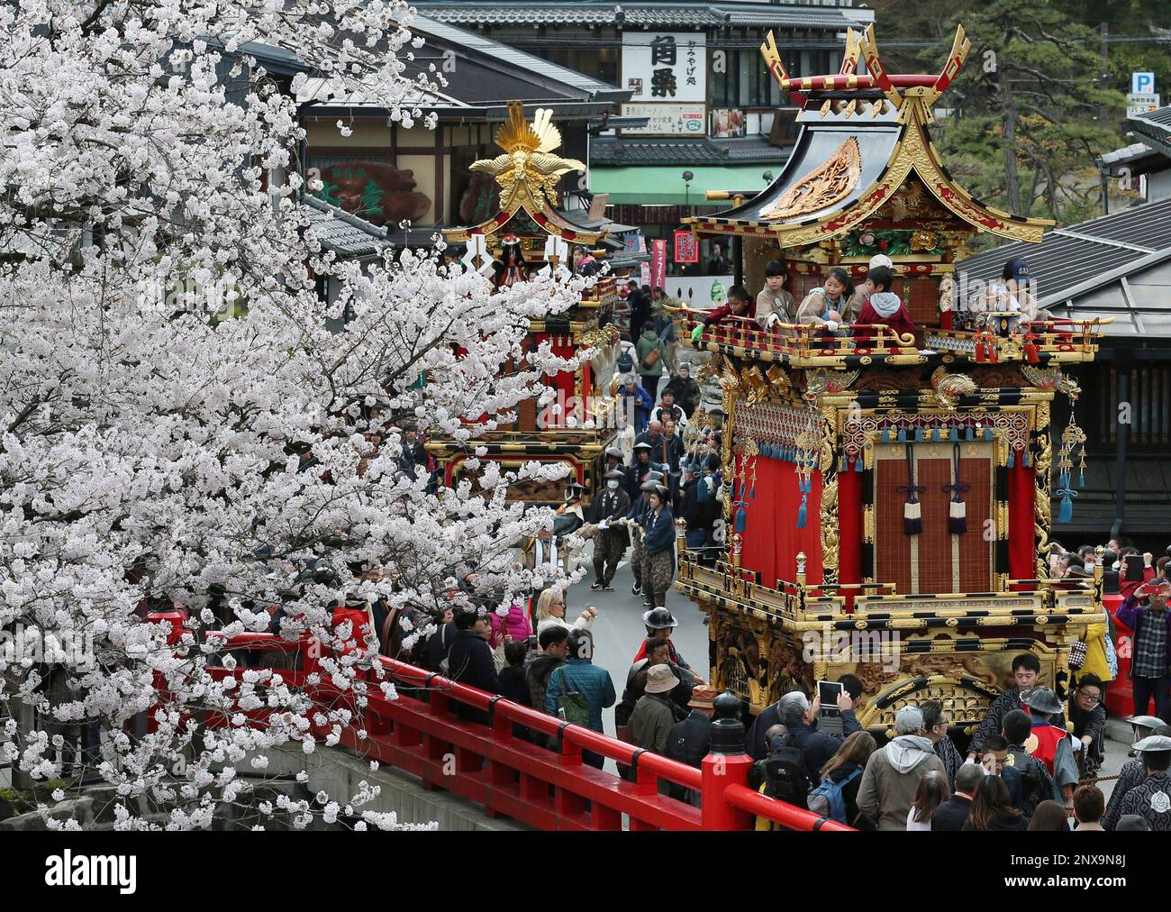 Floats decorated with lanterns parade during Takayama Spring Festival ...