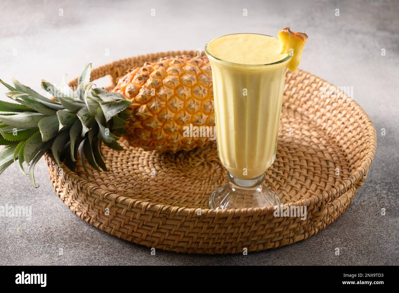 Asian traditional Pineapple lassi on gray background. Freshness cold ...