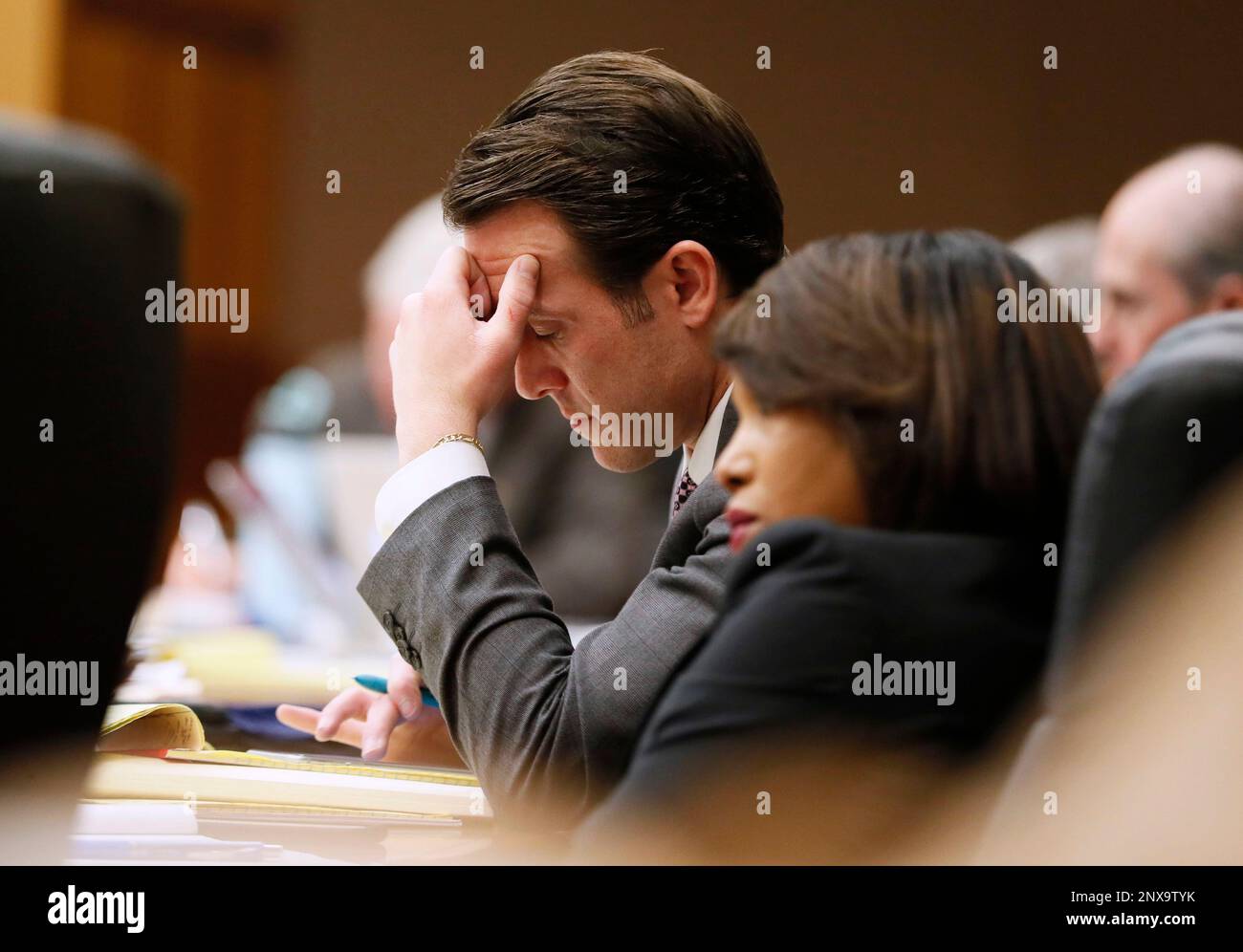 Prosecuting attorney Adam Abbate listens during cross examination of ...