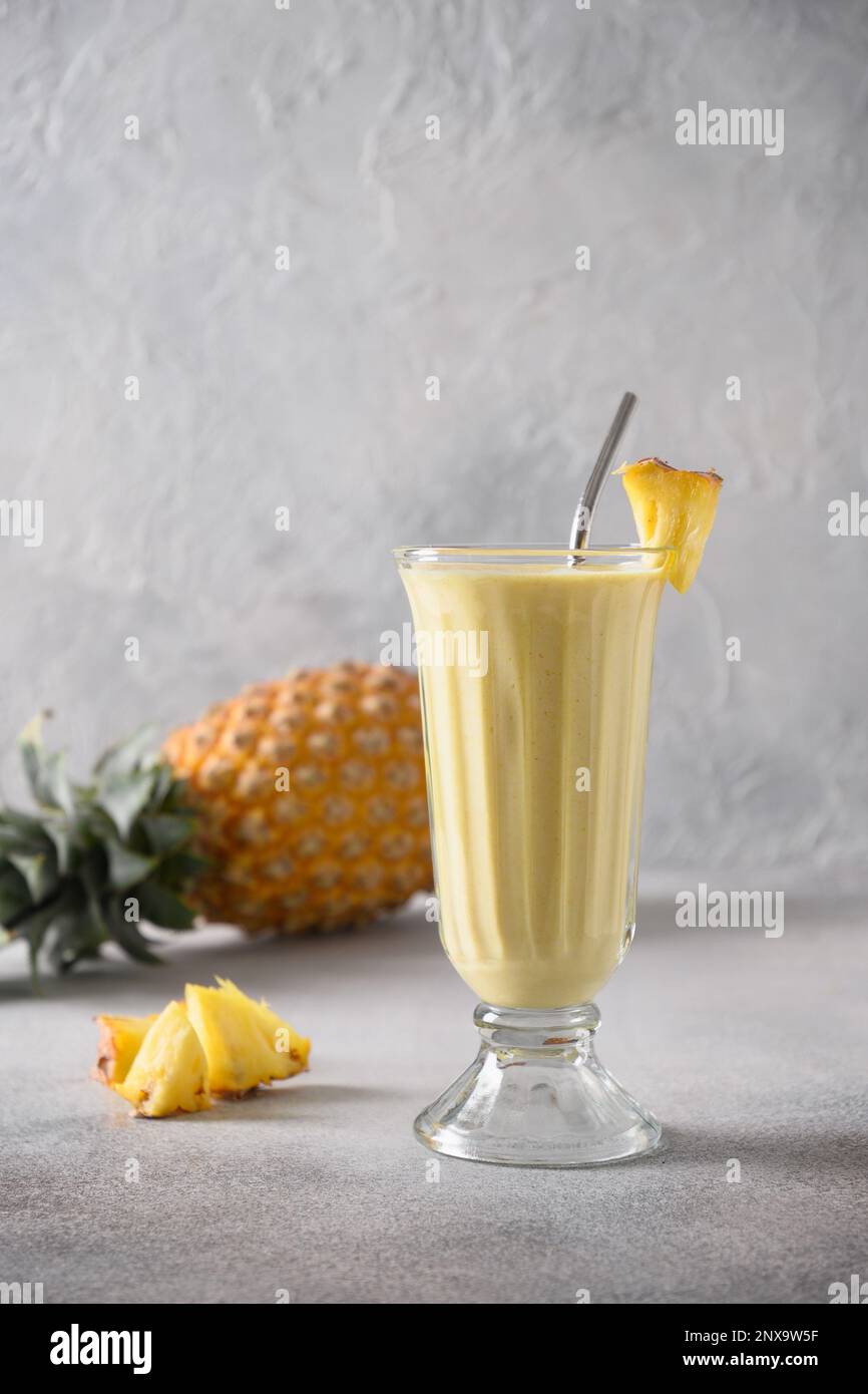 Asian traditional Pineapple lassi on gray background. Freshness cold ...