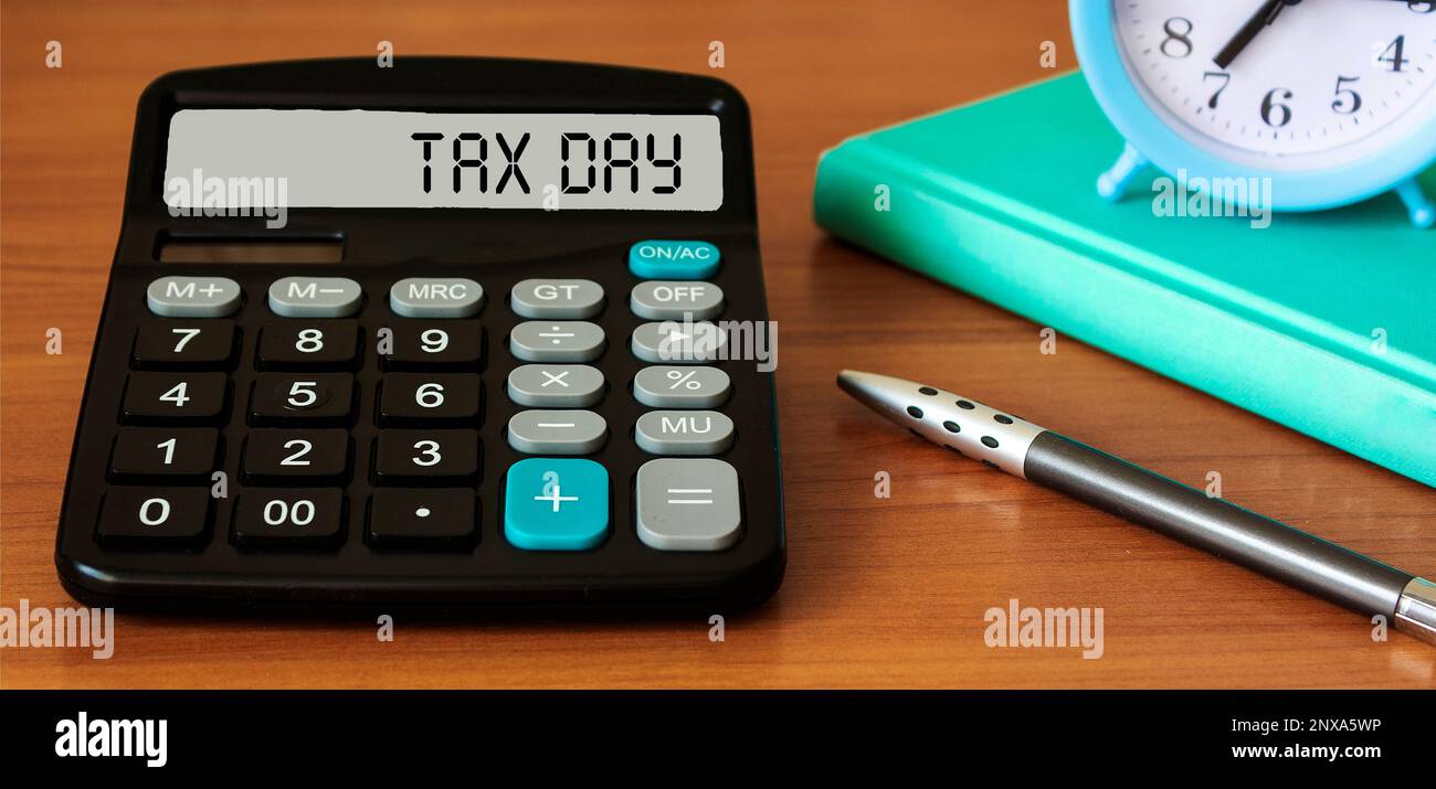 Tax day words written on calculator display, business concept Stock ...