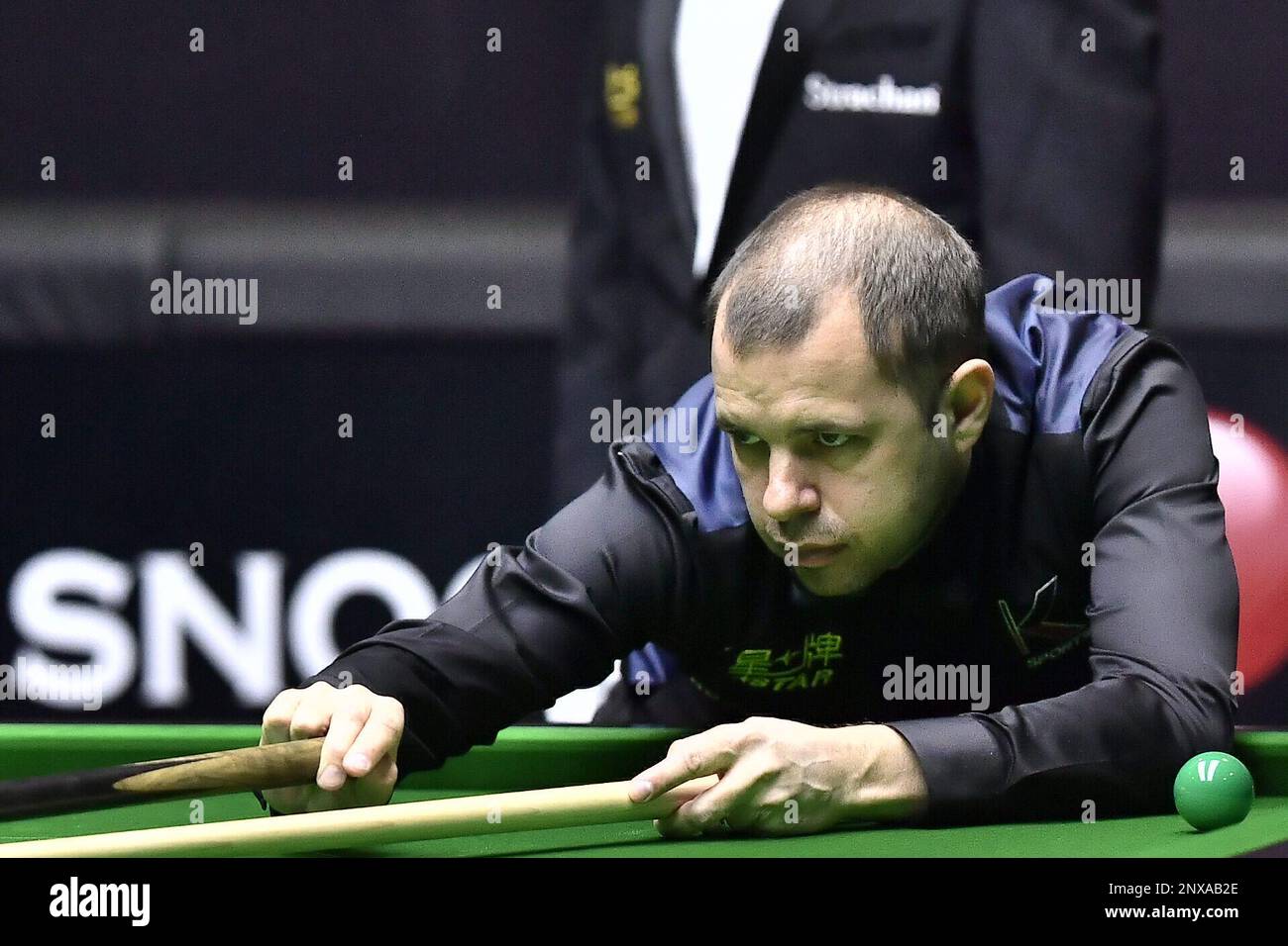 Barry Hawkins of England plays a shot to Neil Robertson of Australia in ...