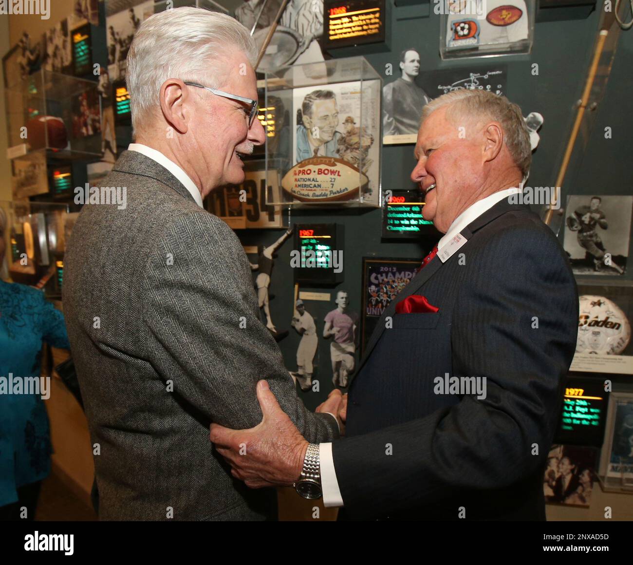 Former Texas Tech basketball coach Gerald Myers, right, is greeted by ...