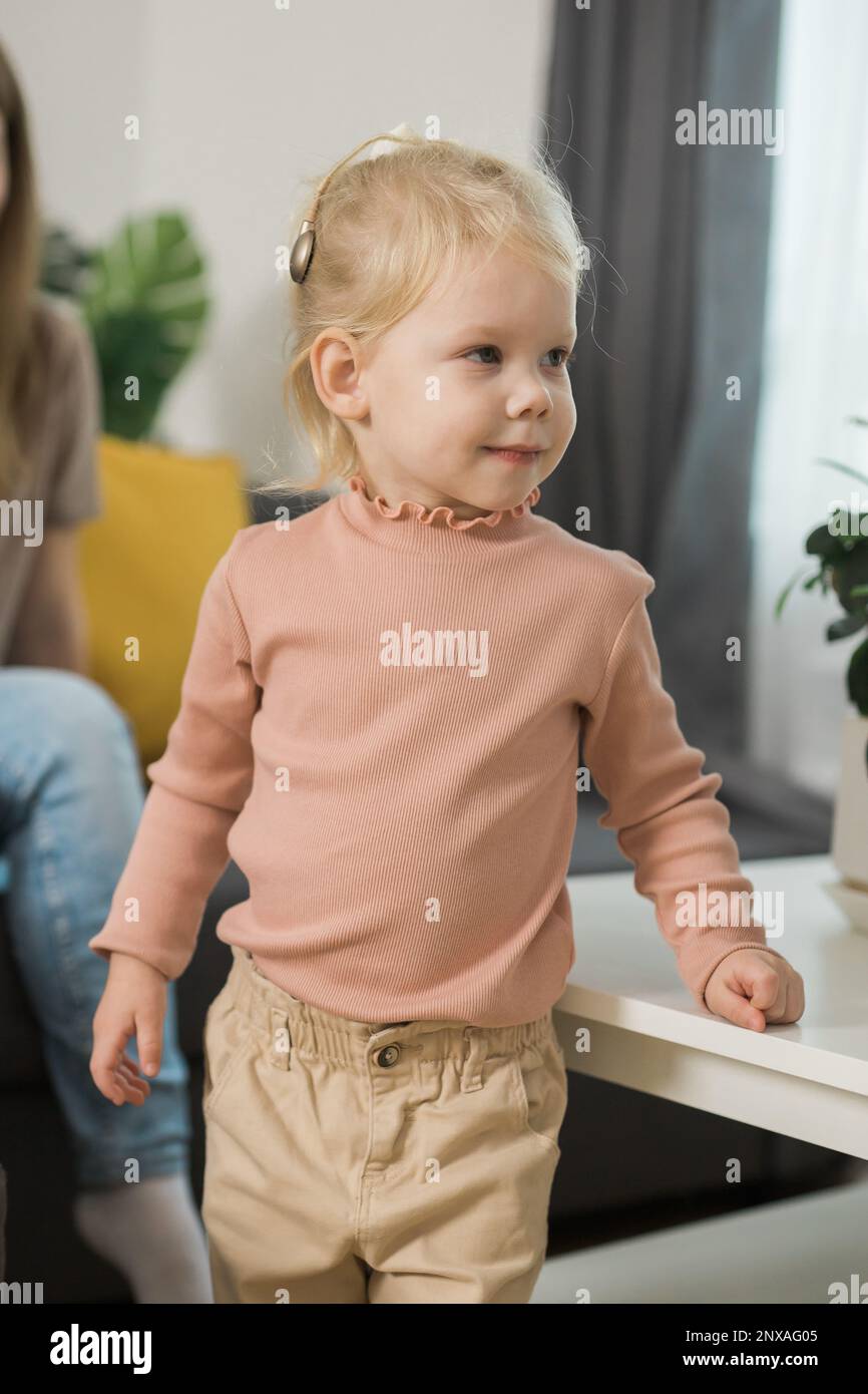 Deaf child girl with cochlear implant studying to hear sounds ...