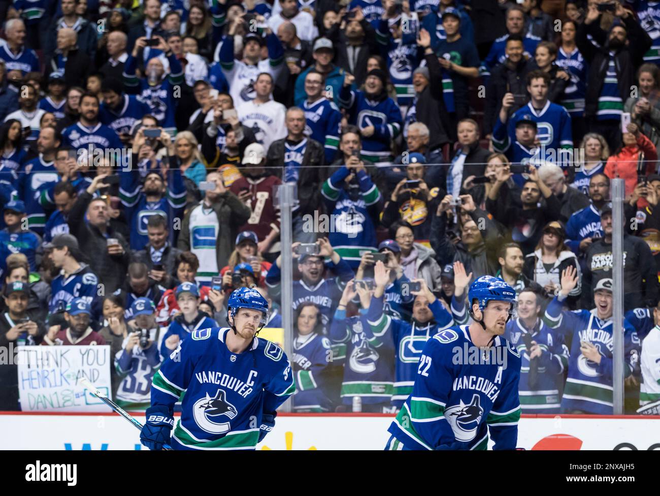 Vancouver Canucks' Henrik Sedin, left, and his twin brother, Daniel ...