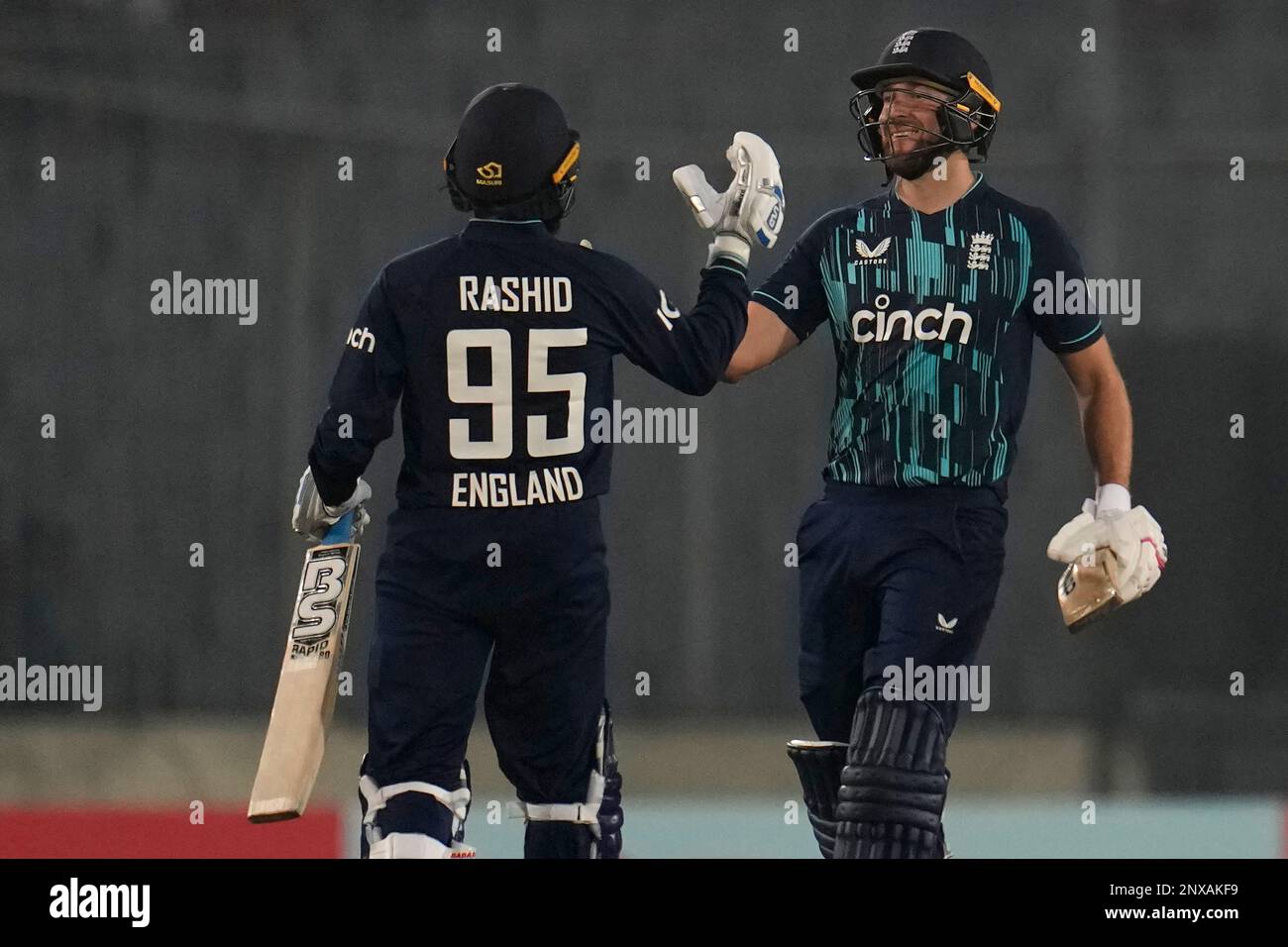 England's Dawid Malan, right, and Adil Rashid celebrate after their win ...