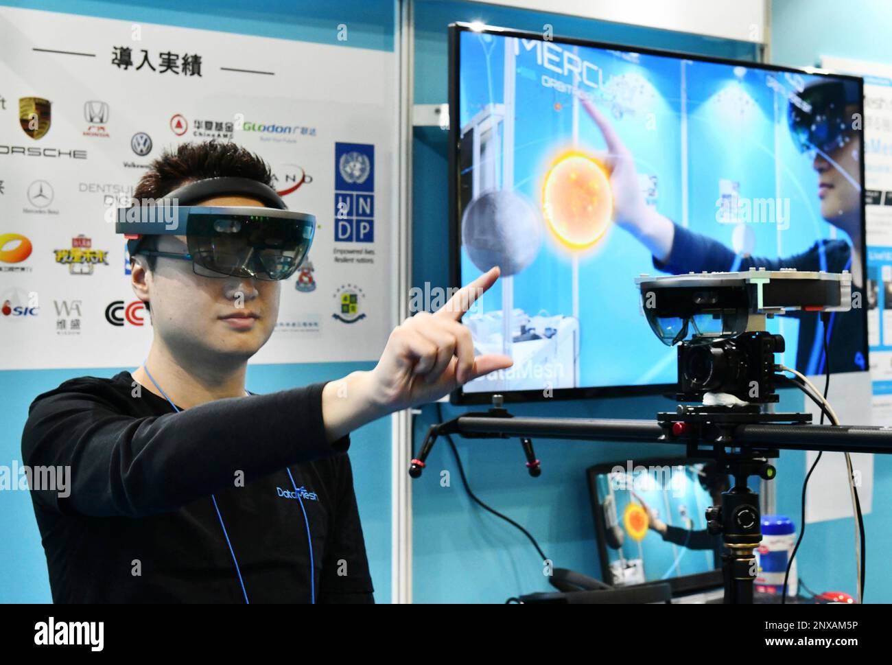 A man uses MR (mixed reality) device that can manipulate images of the ...