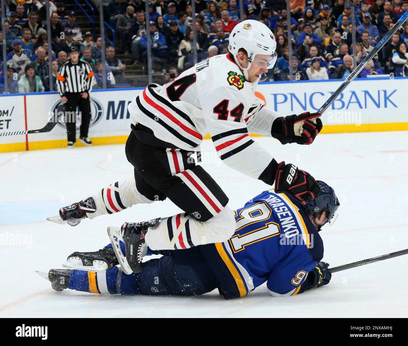 Chicago Blackhawks defenseman Jan Rutta, top, tries to avoid colliding ...