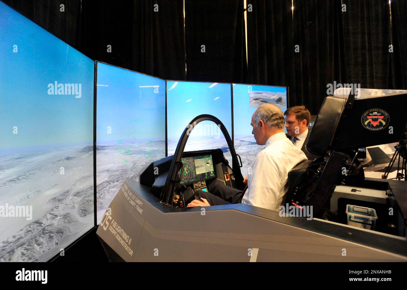 Lockheed Martin employee, Jeff Virosi, a retired F-15 pilot, right ...