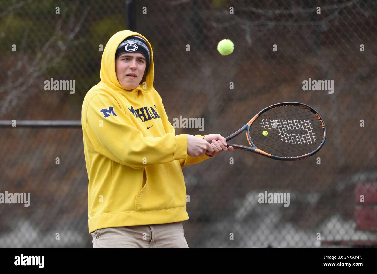 Max Kelly, of Pottsville, Pa., eyes up the ball while he plays tennis ...