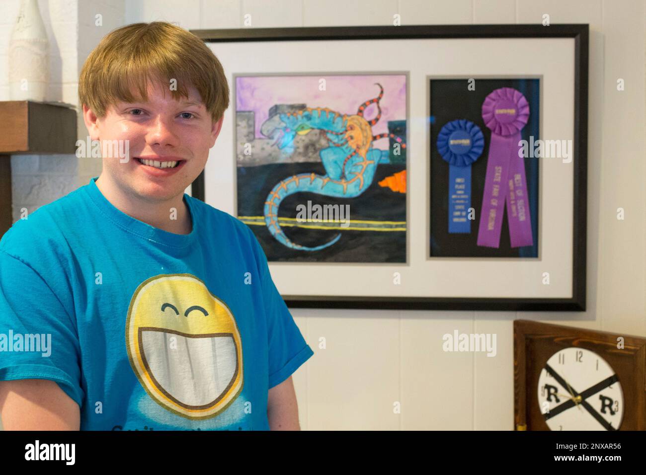 In this March 23, 2018, photo, artist Joey Frye stands next to one of ...