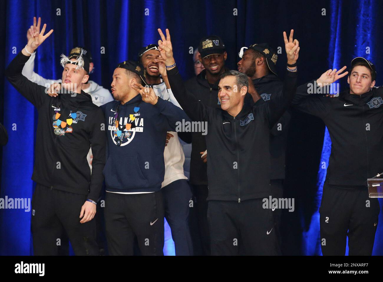 Villanova men's basketball coach Jay Wright holds up his fingers in "V ...