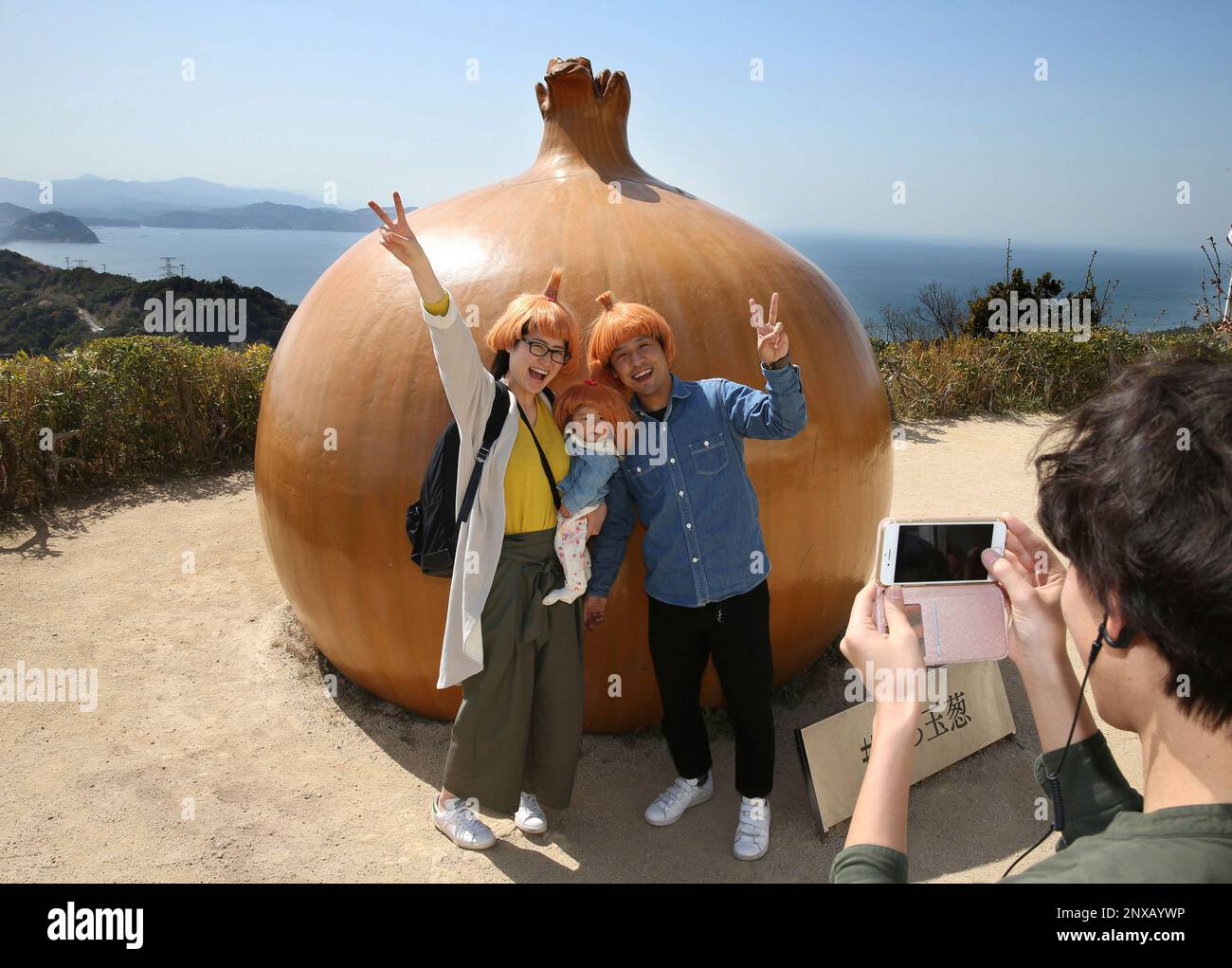 Tourists take pictures with 2.8-meter-high onion in front of Ohnaruto ...