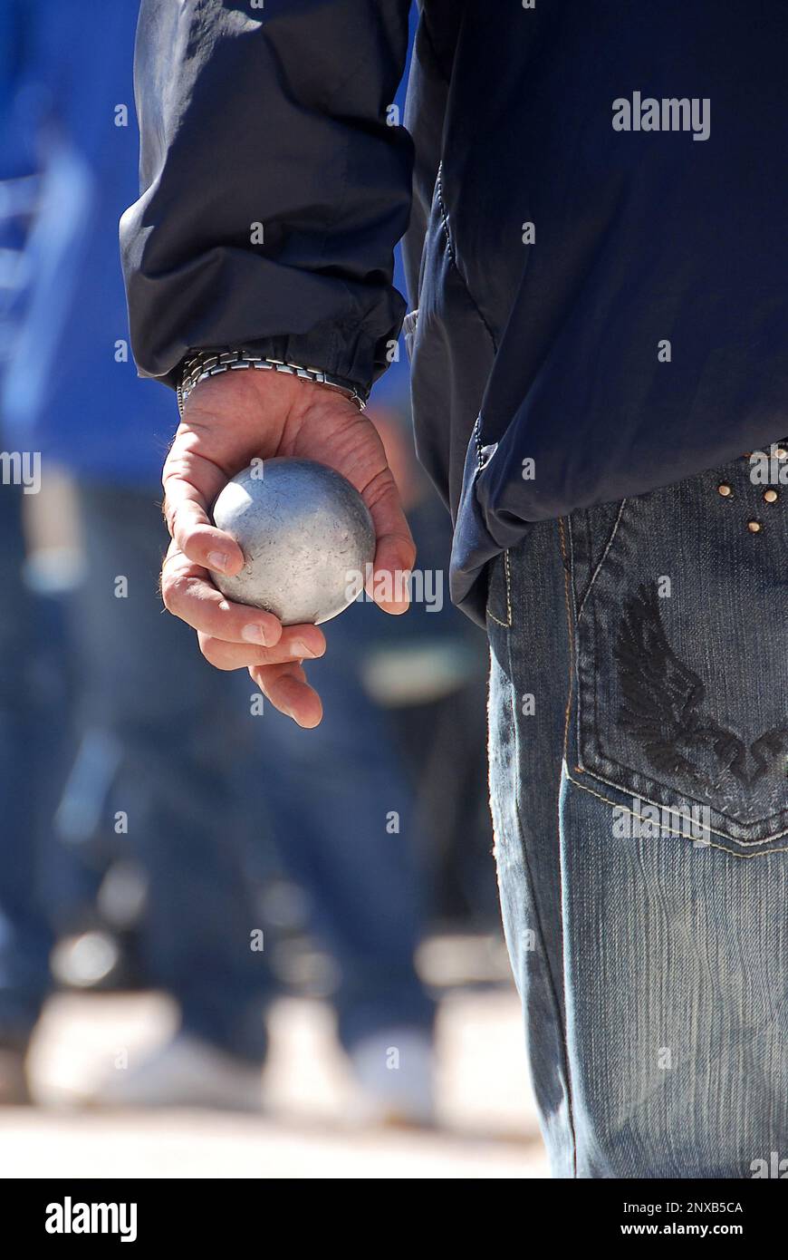 Boule ball in hand of petanque player. Sport in the south of France ...