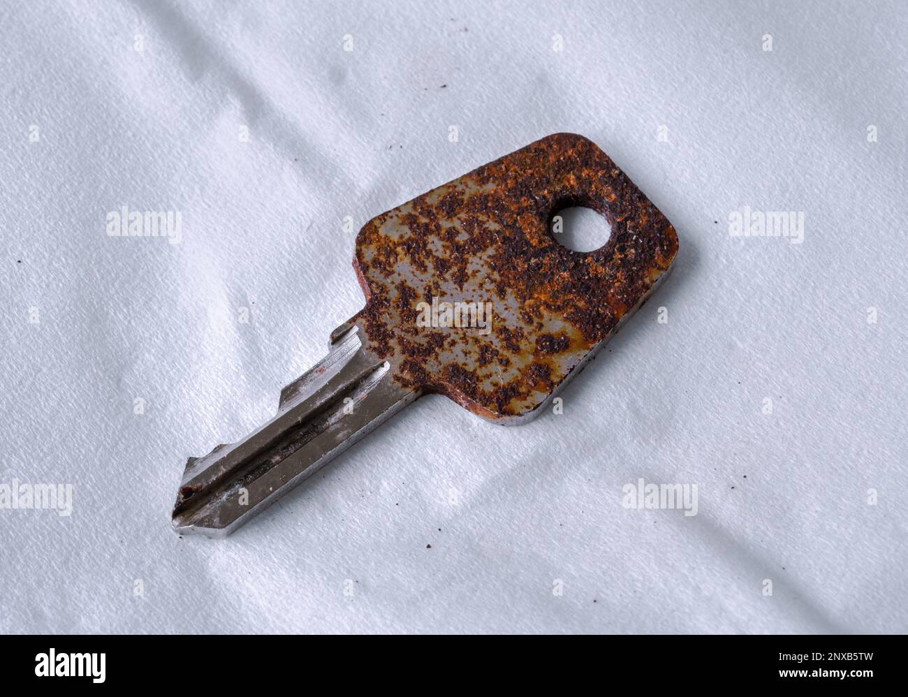 Rusty key on tissue paper Stock Photo - Alamy