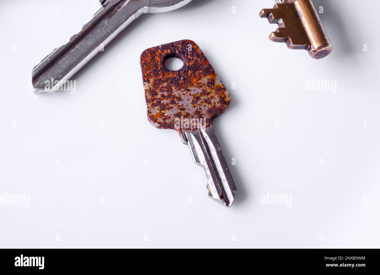 Small corroded key on white background 1 Stock Photo - Alamy