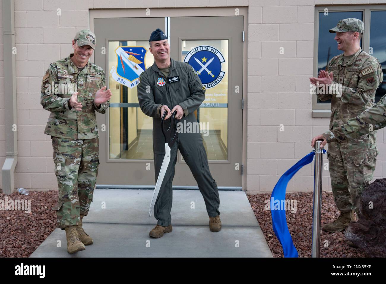 Colonel James Hewitt, 688th Cyberspace Wing commander, left, and ...