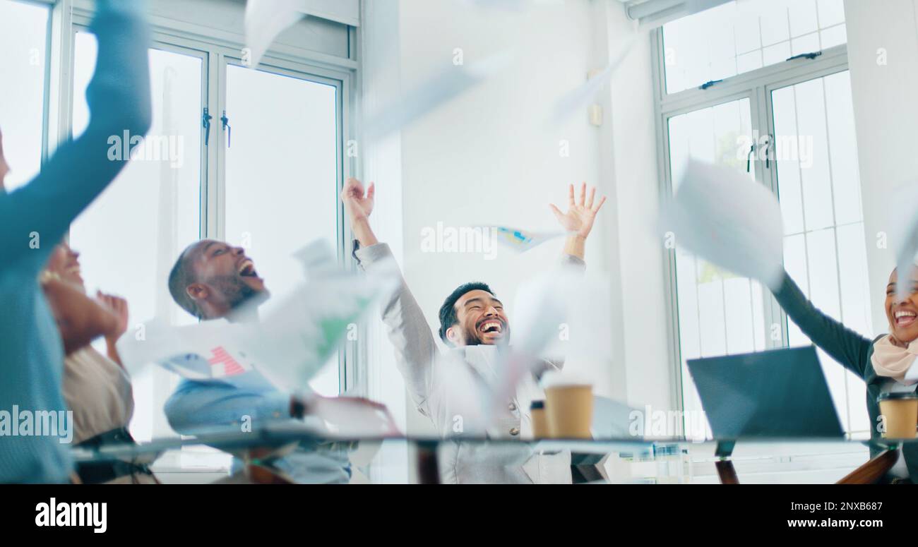 Celebration, teamwork and business meeting with documents in the air ...