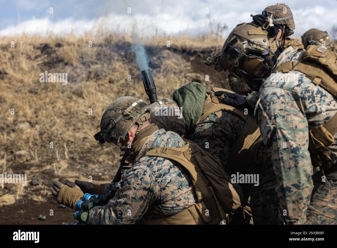 U.S. Marines with 3d Battalion, 4th Marines fire a Mark 19 40 mm ...