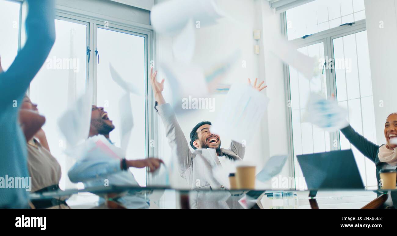 Celebration, teamwork and business meeting with documents in the air ...