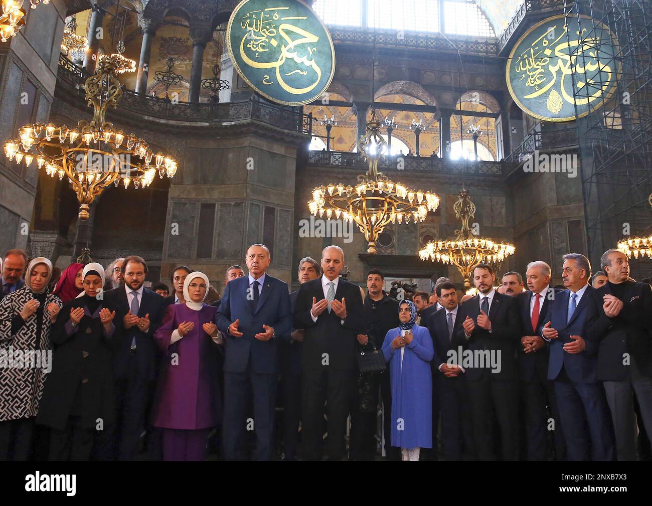 Turkey's President Recep Tayyip Erdogan, centre left, offers prayers ...