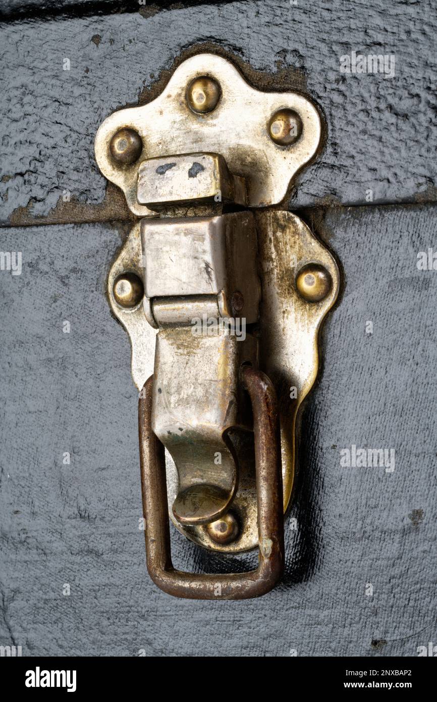 Clasp or lock of an old fashioned wooden trunk. A black trunk with ...