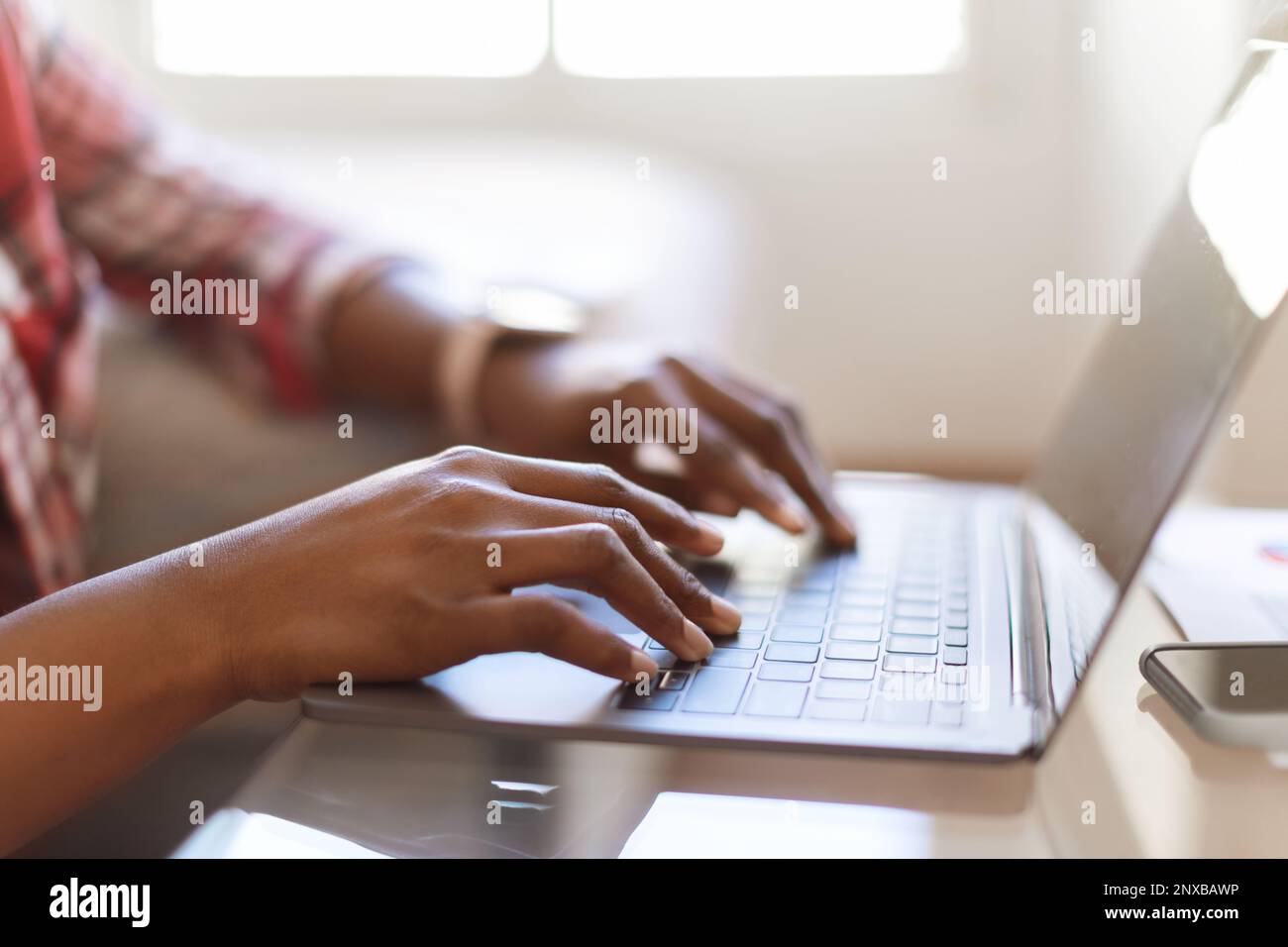 Black woman hands typing on pc laptop keyboard, cropped Stock Photo - Alamy