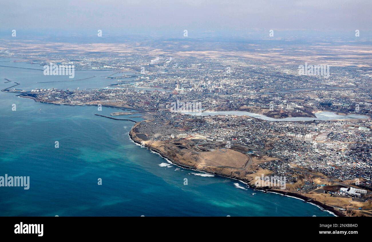 An aerial photo shows a town in Kushiro in Hokkaido on March 27, 2018 ...