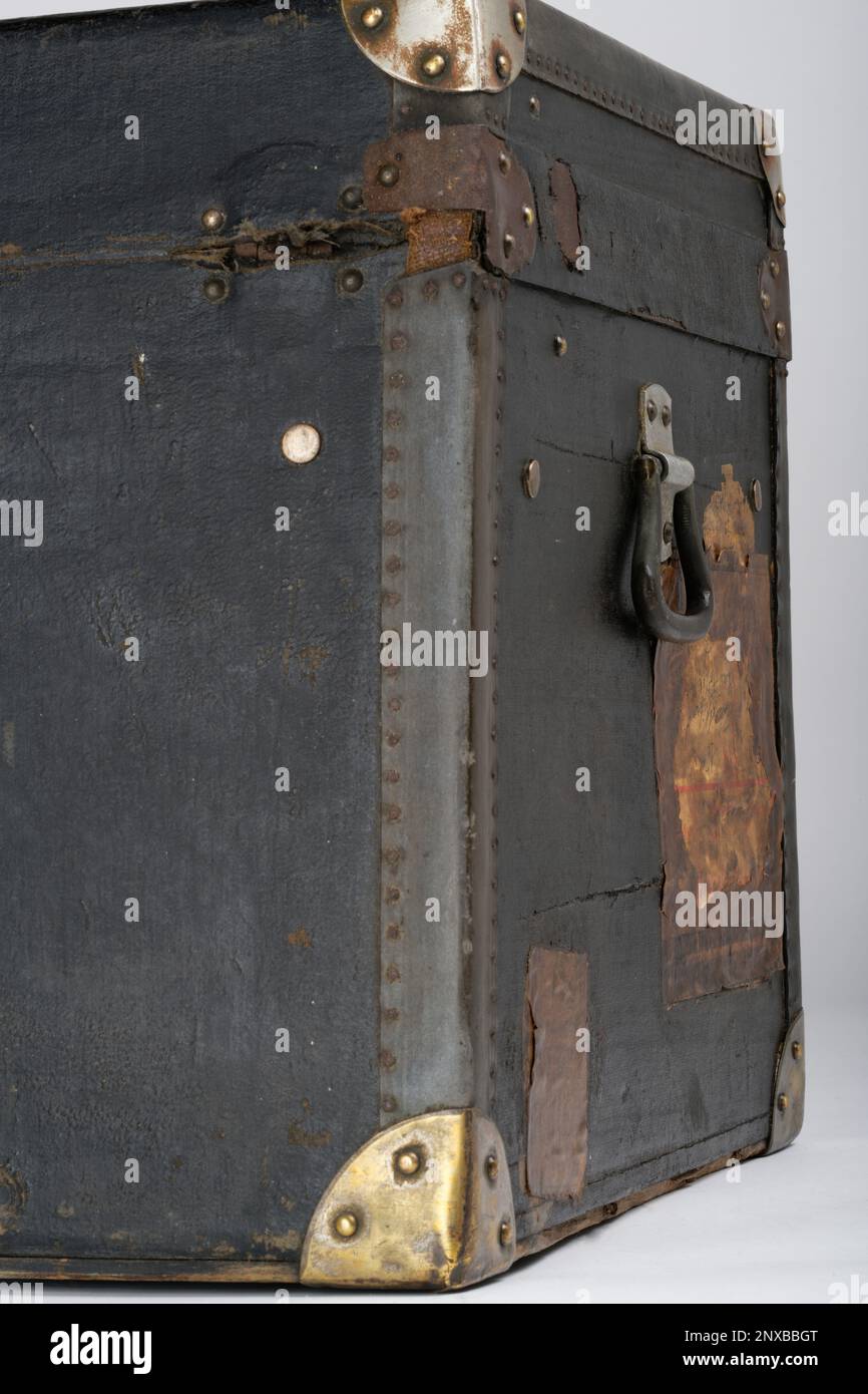 Close up pictures of an old fashioned wooden trunk. A black trunk with ...