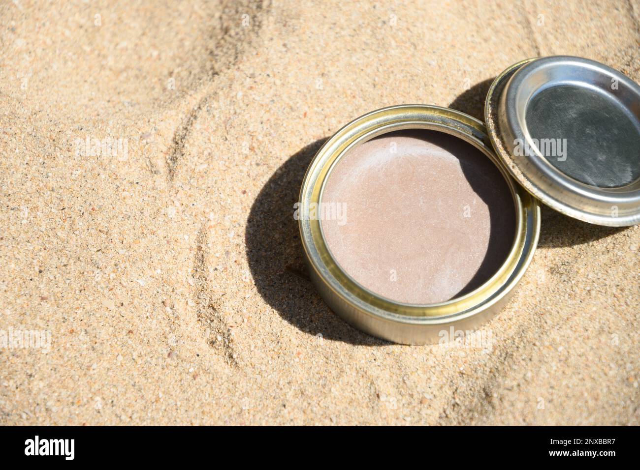 Solar zinc in metal box on sand on bright sunny day. Best and long ...