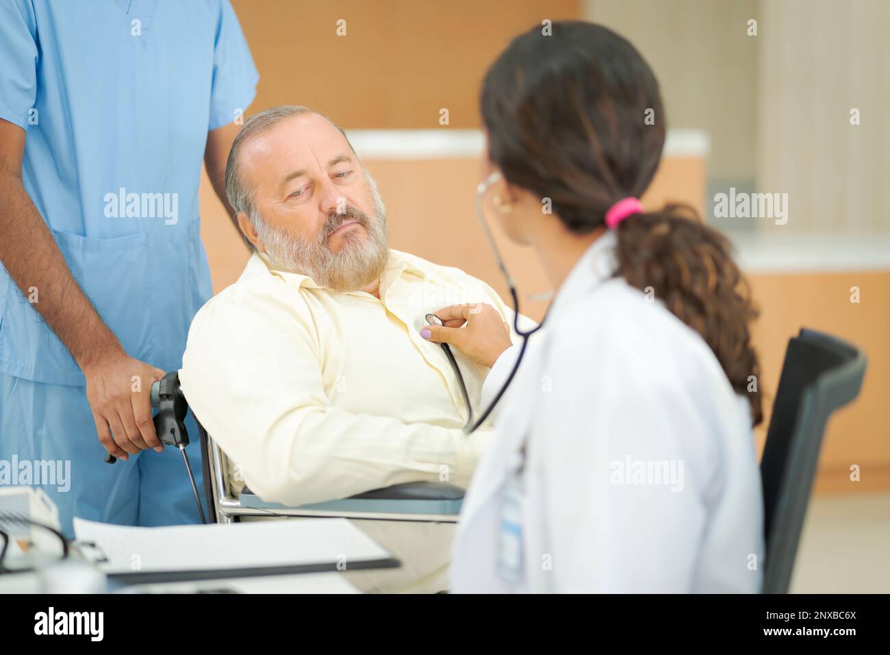 An elderly male patient with high body fat, obesity, sees a doctor at ...