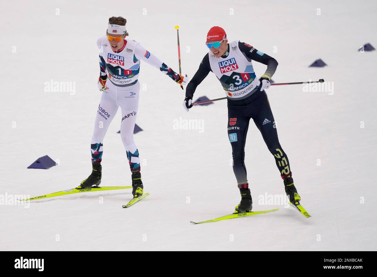 Espen Andersen, of Norway, left, and Eric Frenzel, of Germany, compete ...