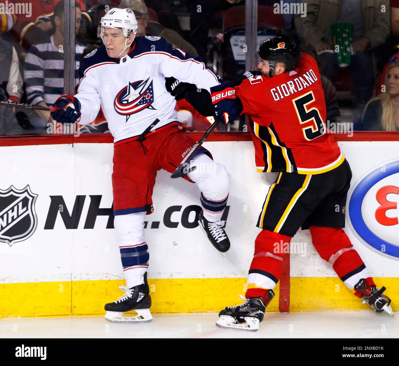 Columbus Blue Jackets left wing Matt Calvert (11) is run into by ...