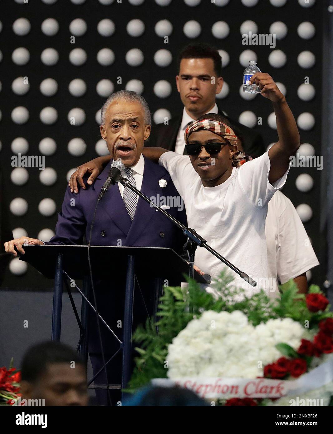Rev. Al Sharpton, left, speaks to Stevante Clark during the funeral ...