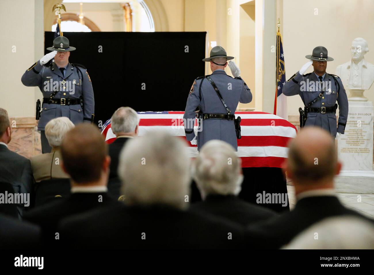 An honor guard salutes at the state funeral Wednesday, March 28, 2018 ...