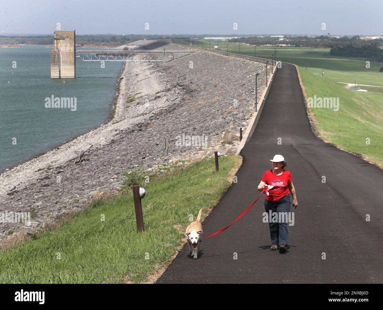 In this March 25, 2018, photo Naomi DiRago walks her dog, Luna, on the ...