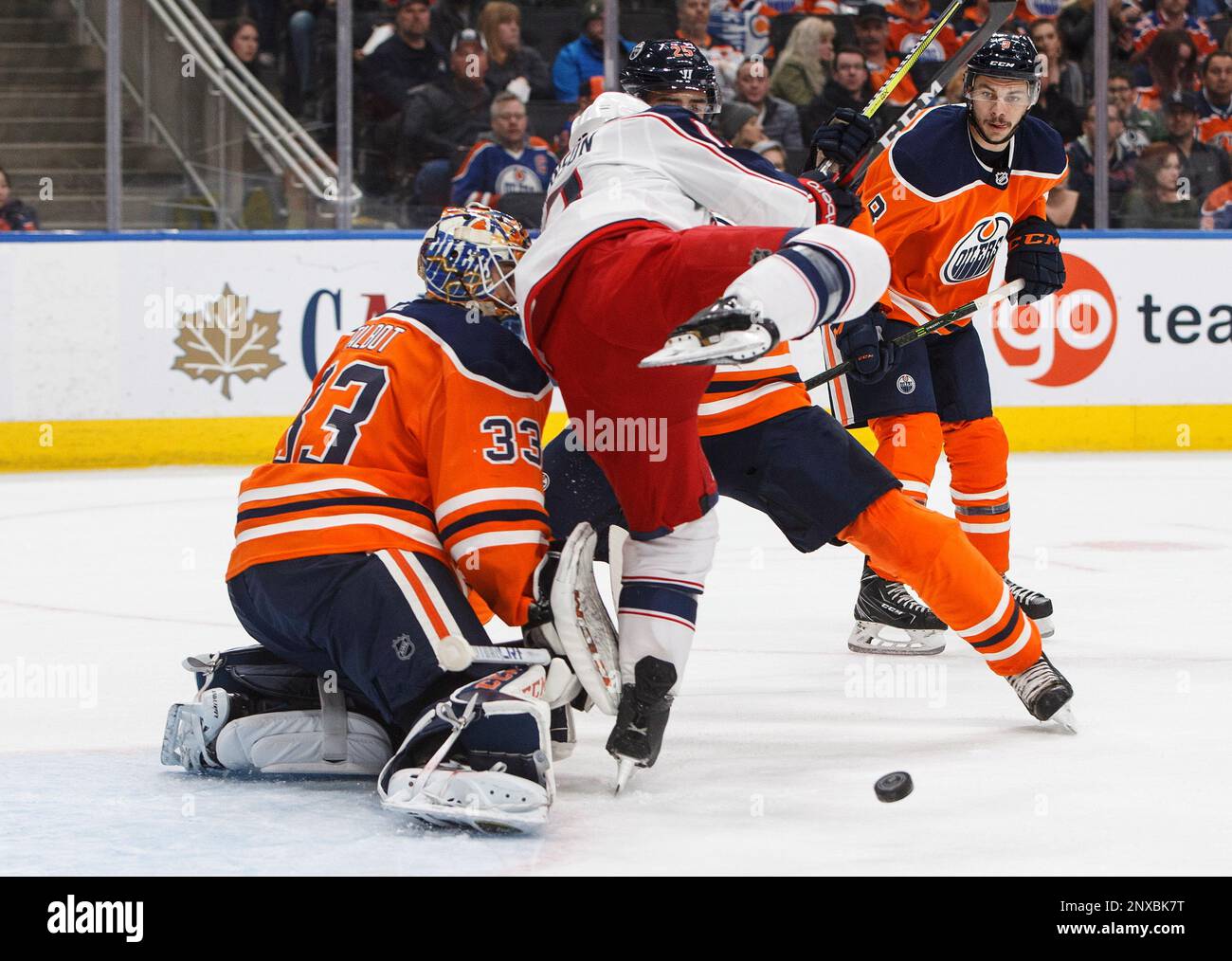 Edmonton Oilers' goalie Cam Talbot (33) makes the save as Columbus Blue ...