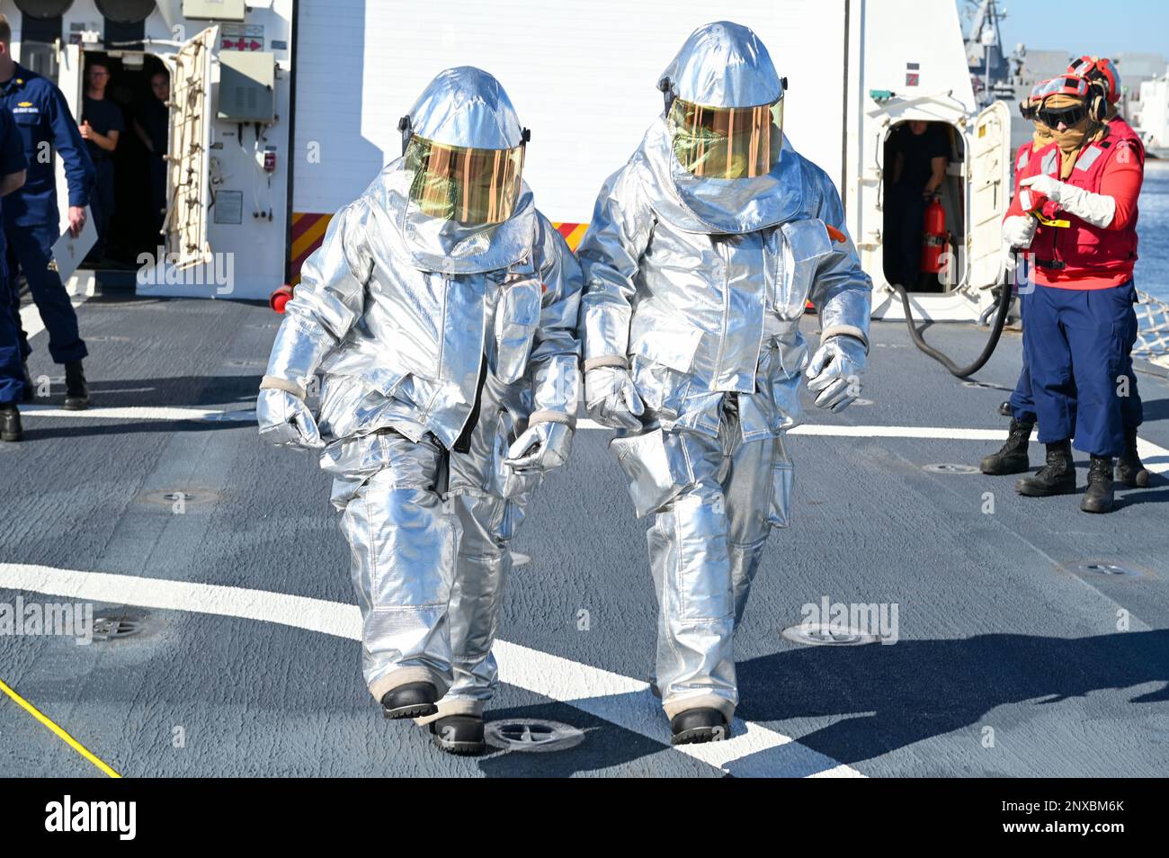 USCGC Stone’s (WMSL 758) crew runs a crash response training evolution ...