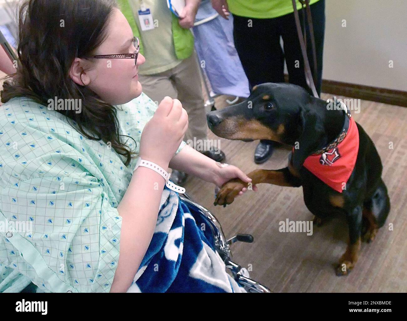 In this Thursday, March 22, 2018 photo, Rylee Parker shakes hands with ...