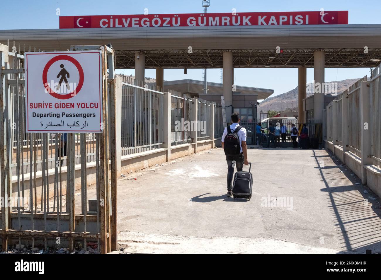 Male Syrian Refugee Returning To The Secured Area In His Country