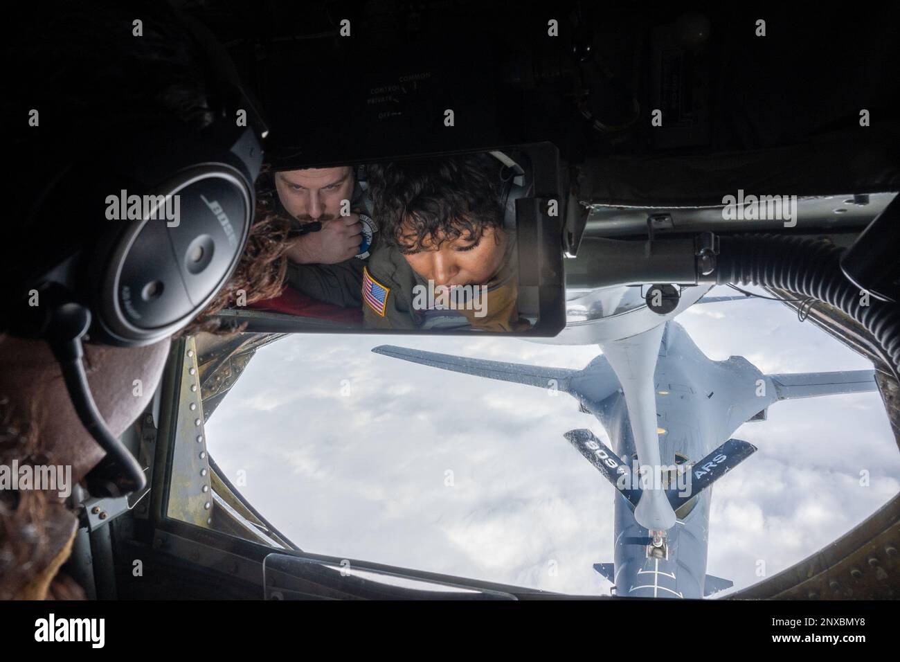 U.S. Air Force Senior Airman Seth Amiott, left, observes Senior Airman ...