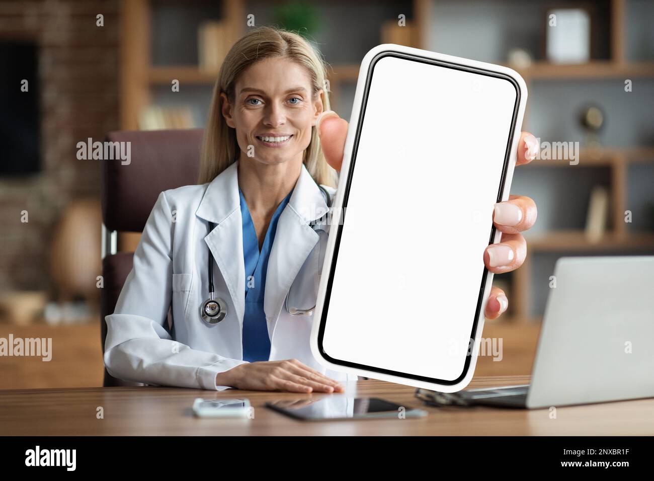 Medical Insurance. Smiling Doctor Lady Wearing Uniform Showing Blank ...