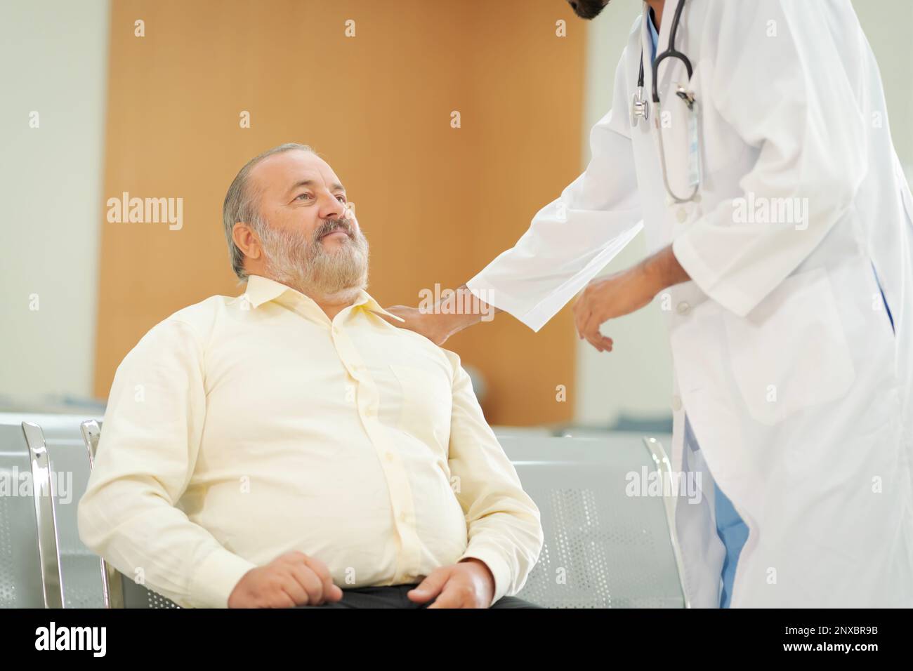 An elderly male patient with high body fat, obesity, sees a doctor at ...