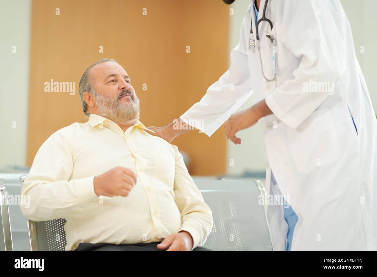 An elderly male patient with high body fat, obesity, sees a doctor at ...