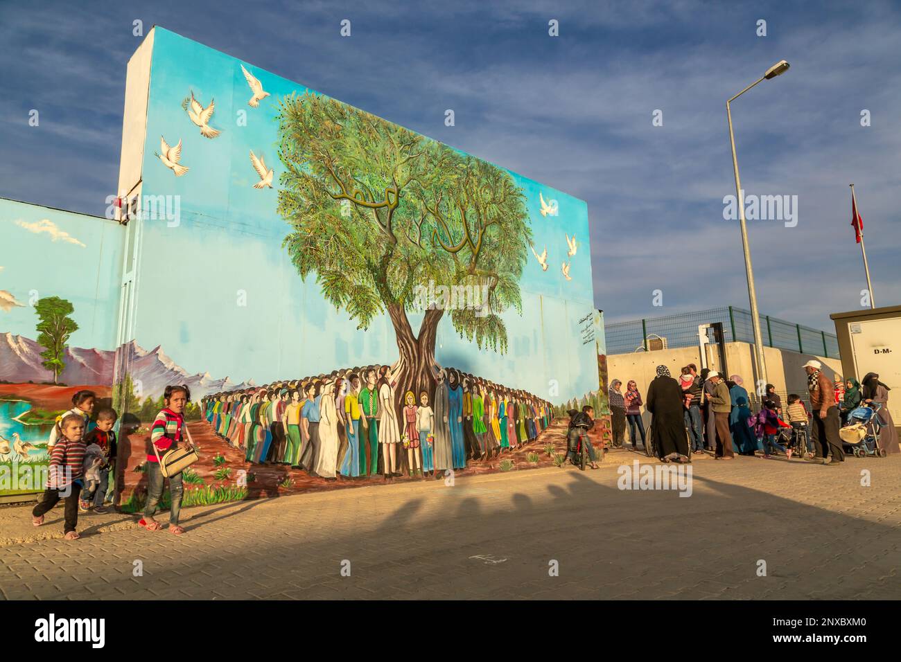 Tree of life painting at the entrance of the camp where Syrian refugees ...