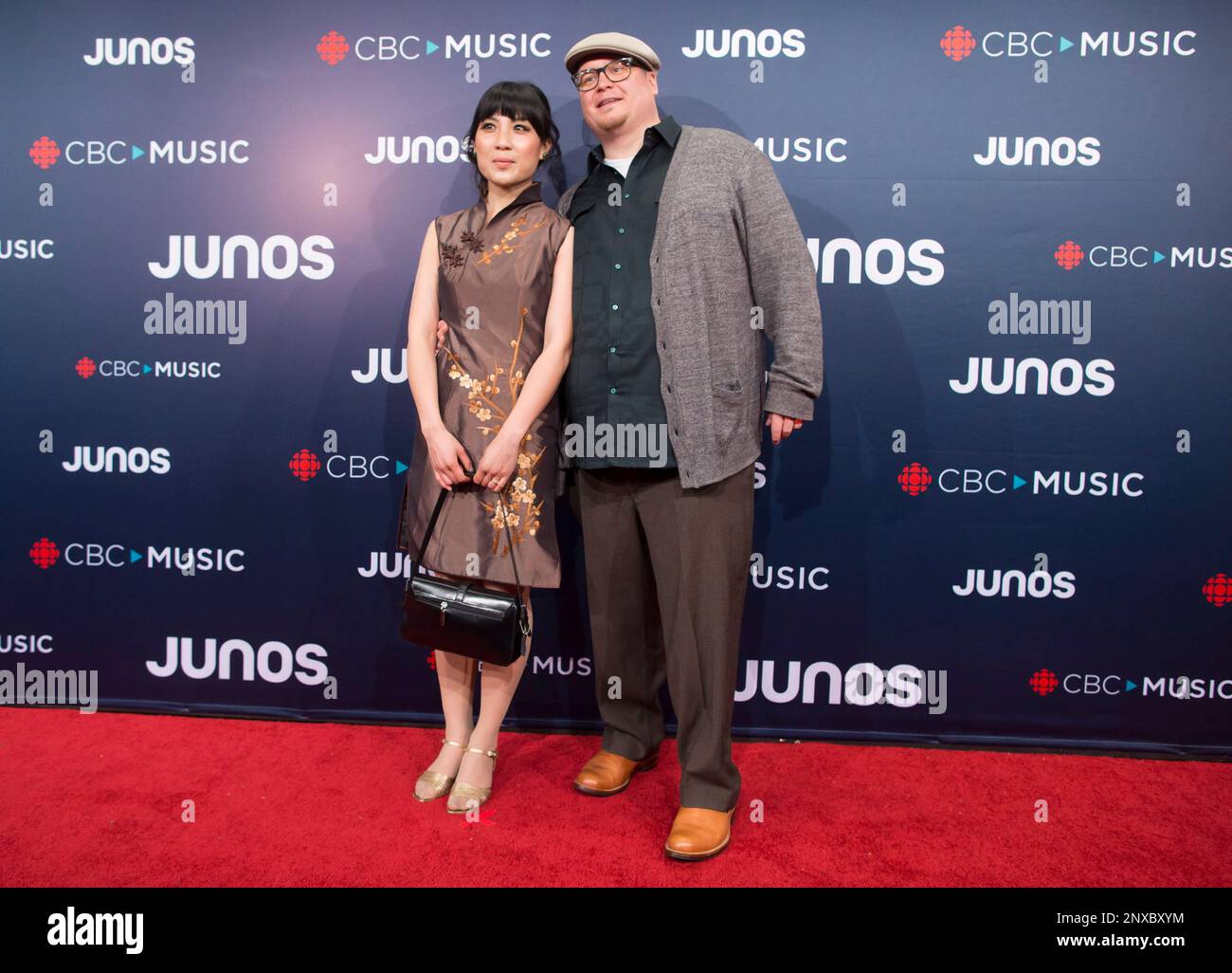 Charlie Demers, right, arrives on the red carpet at the Juno Awards in ...