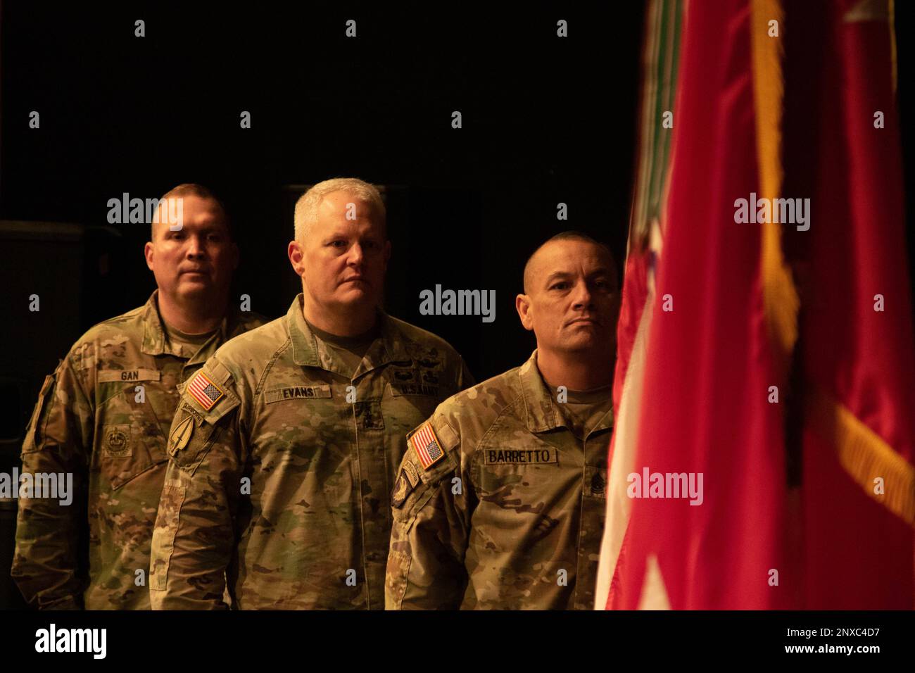 U.S. Army Command Sgt. Maj. Phil K. Barretto, front, outgoing senior ...